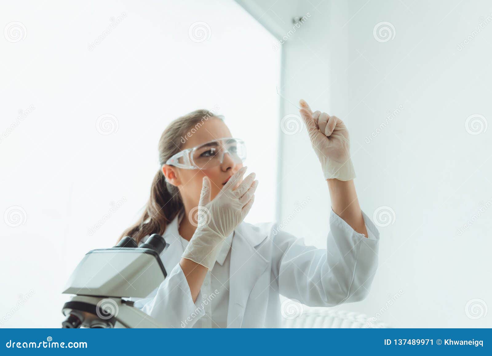 Scientist Research Laboratory in Secure Glasses Using Microscope for ...