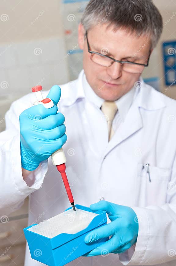Scientist running a test stock photo. Image of working - 14016136