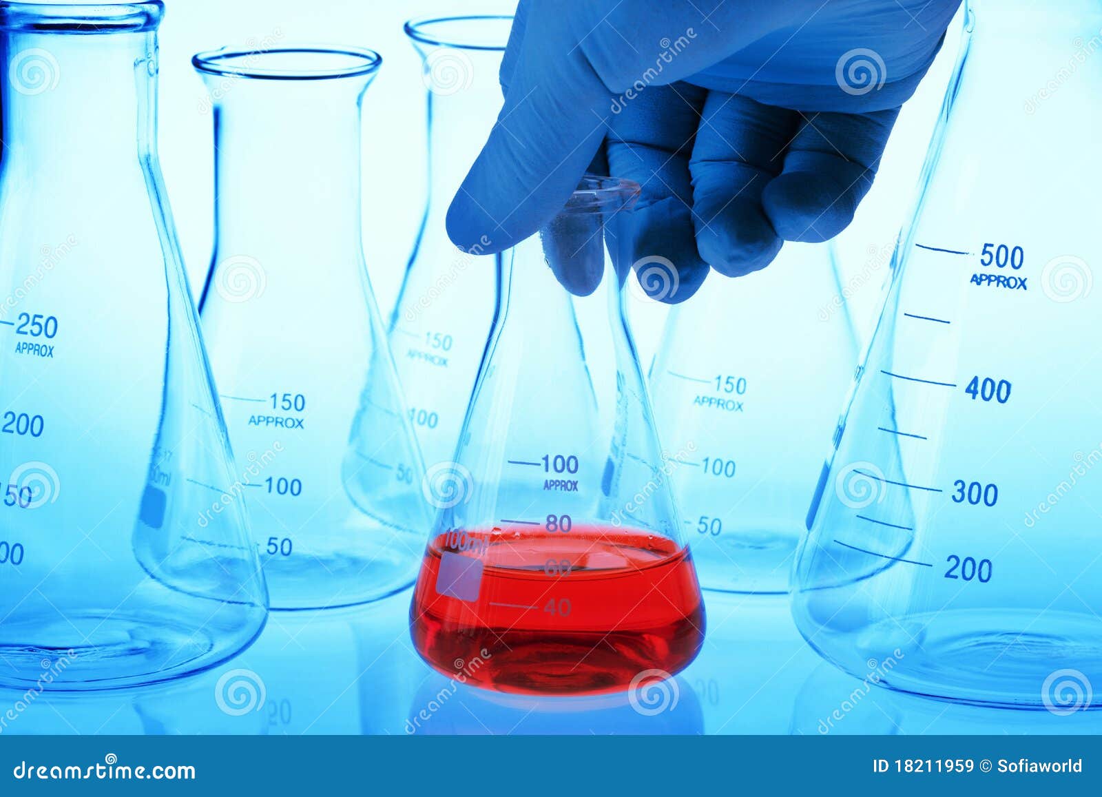 Scientist S Hand Holding Conical Flasks Stock Image - Image of ...