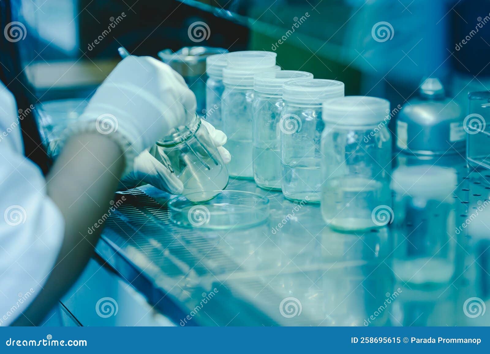 The Scientist`s Hands Pouring Solvent into the Bottles. Stock Image ...
