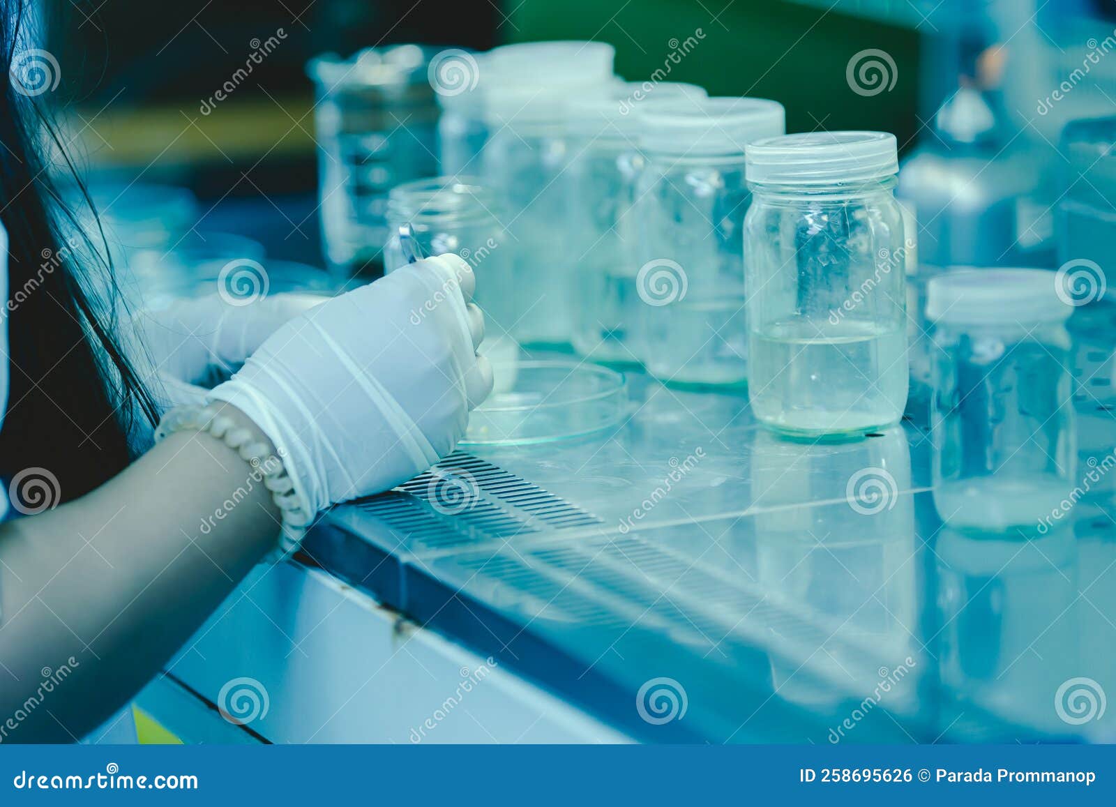 The Scientist`s Hands Pouring Solvent into the Bottles. Stock Photo ...