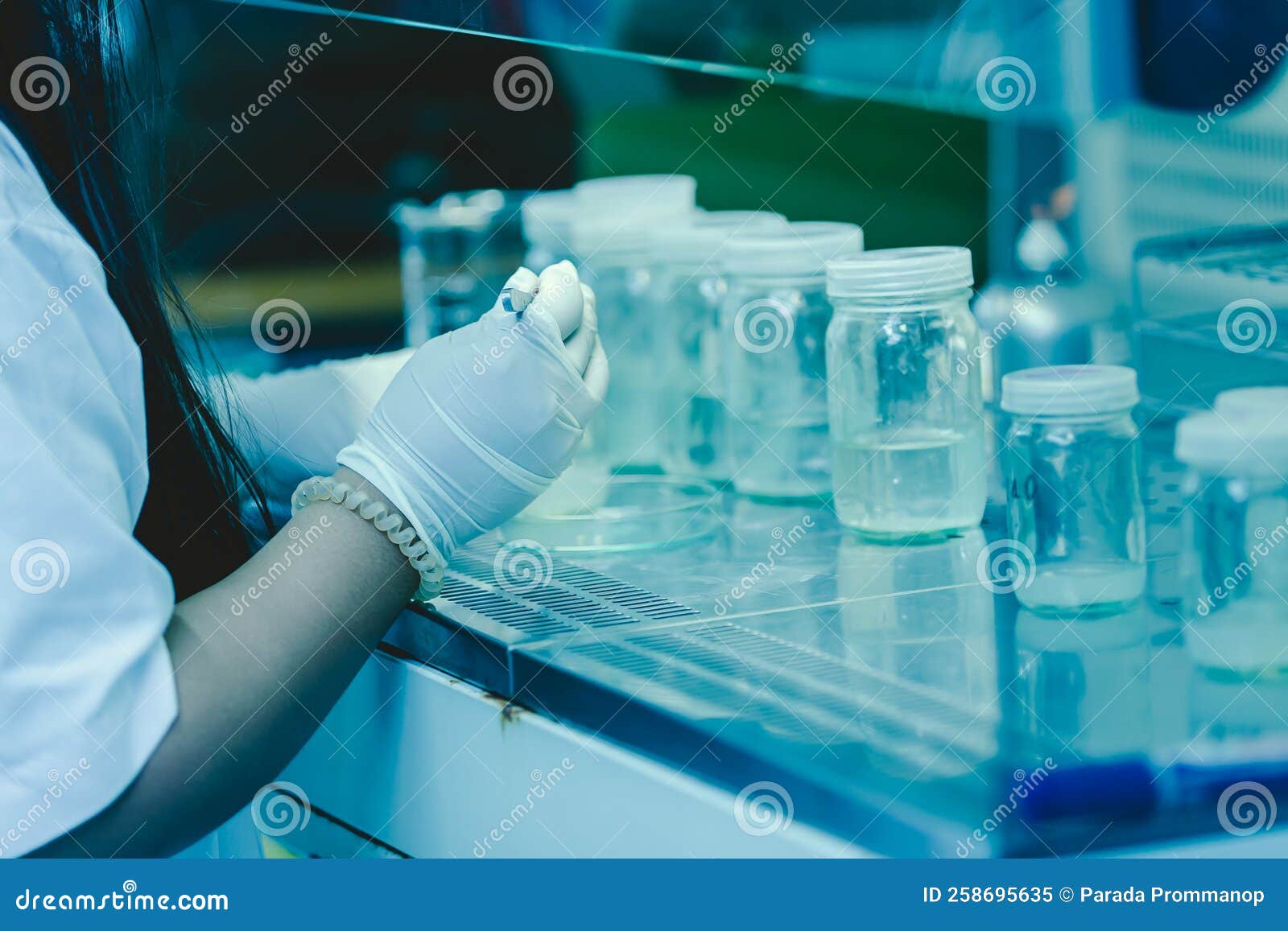 The Scientist`s Hands Pouring Solvent into the Bottles. Stock Image ...