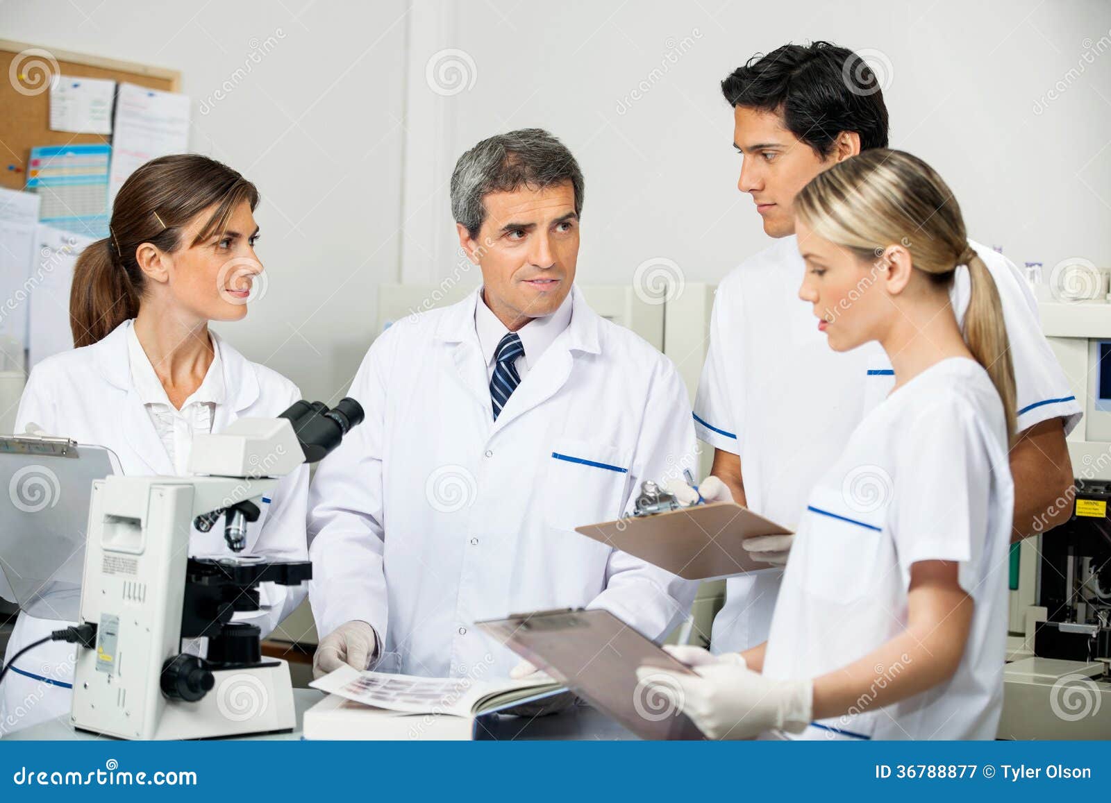 Scientist with Students Taking Notes in Laboratory Stock Image - Image ...