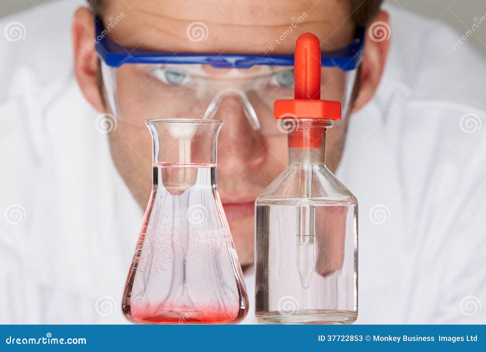 Scientist Studying Flask and Bottle with Dropper Stock Image - Image of ...