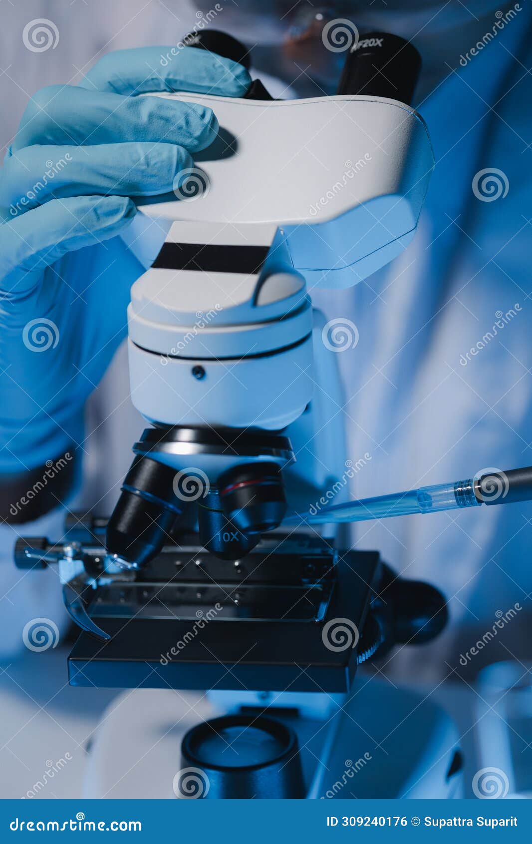 A Scientist is Studying Samples Using a Microscope To Study and Develop ...