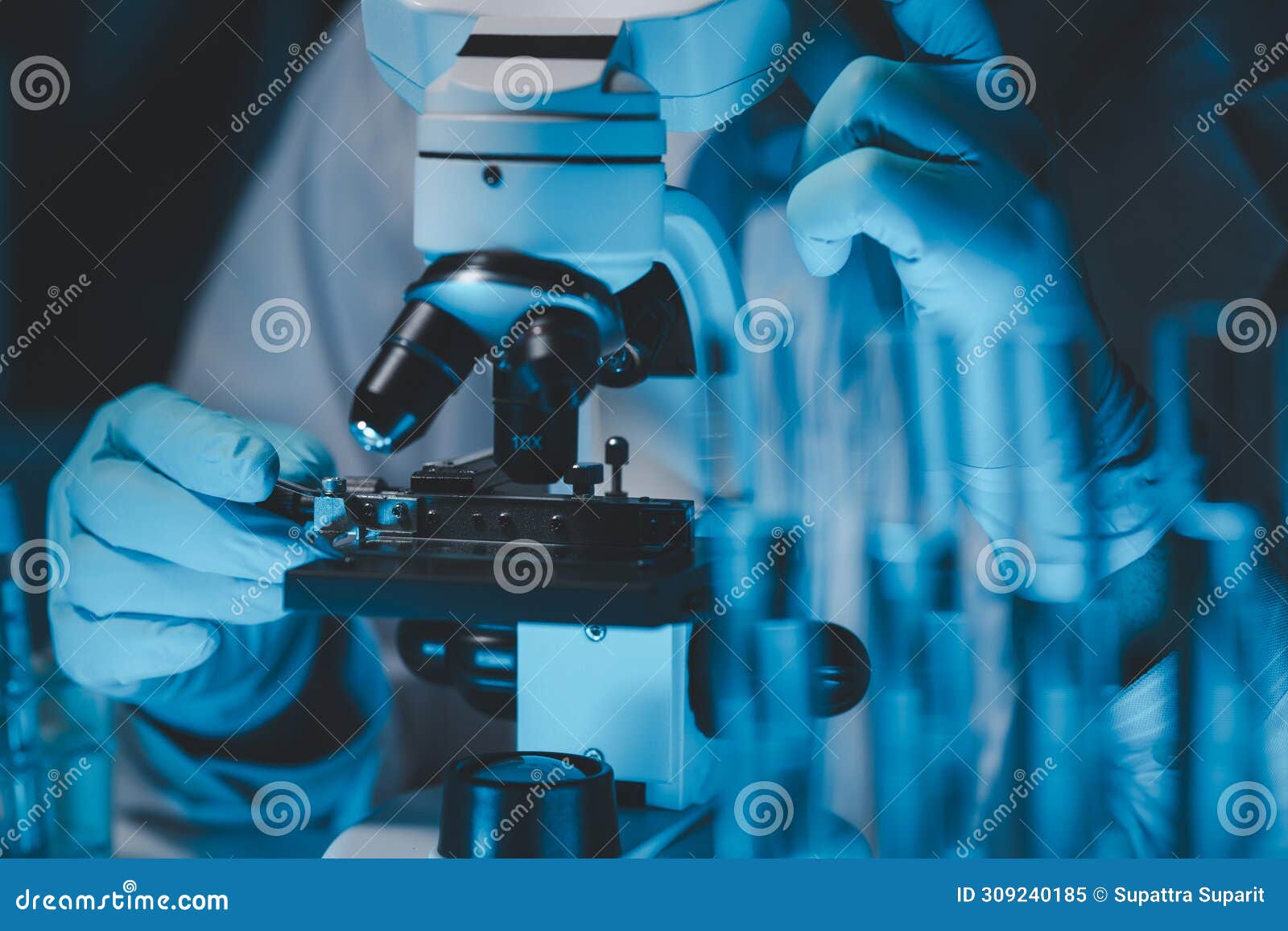 A Scientist is Studying Samples Using a Microscope To Study and Develop ...
