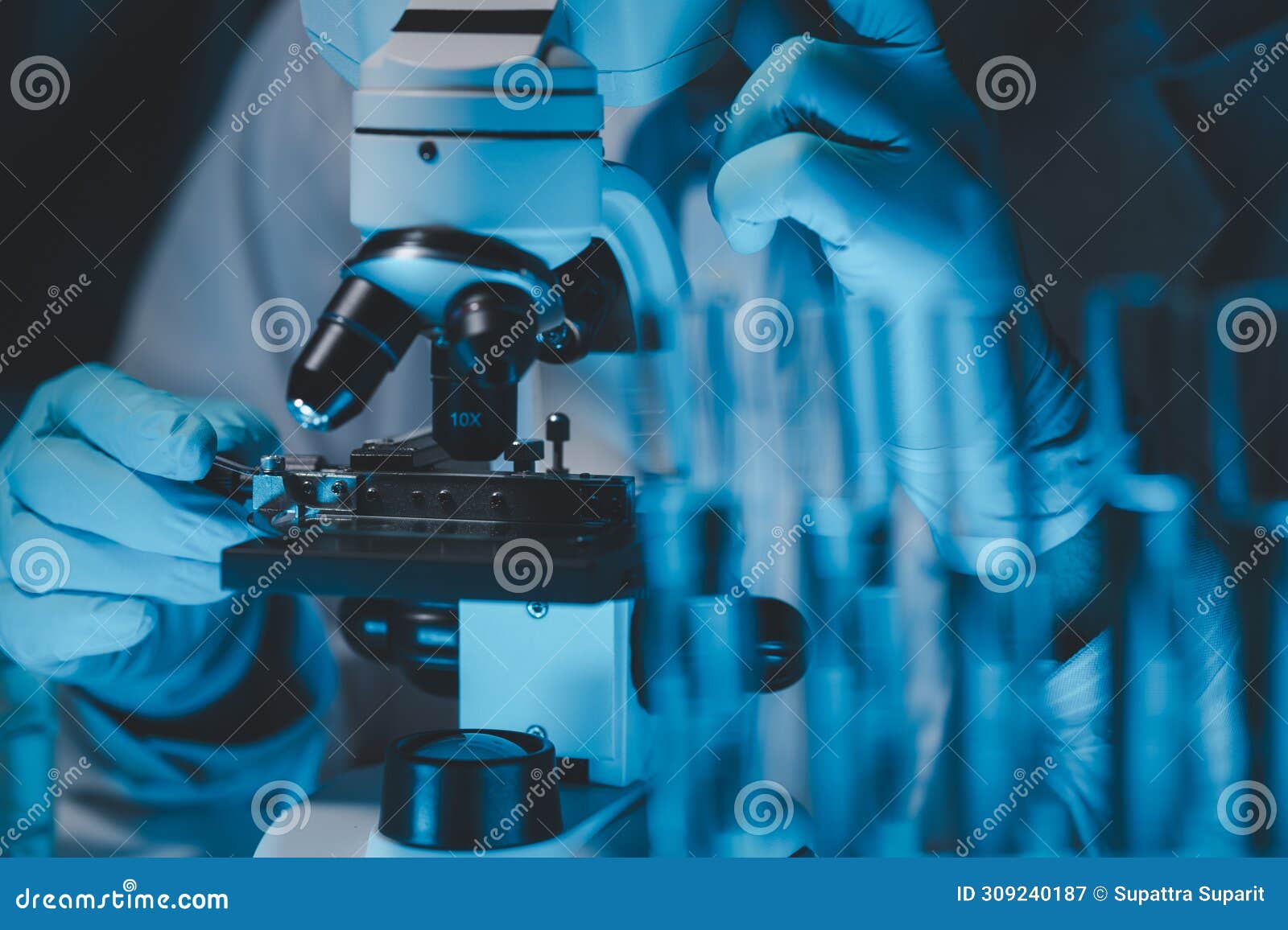 A Scientist is Studying Samples Using a Microscope To Study and Develop ...