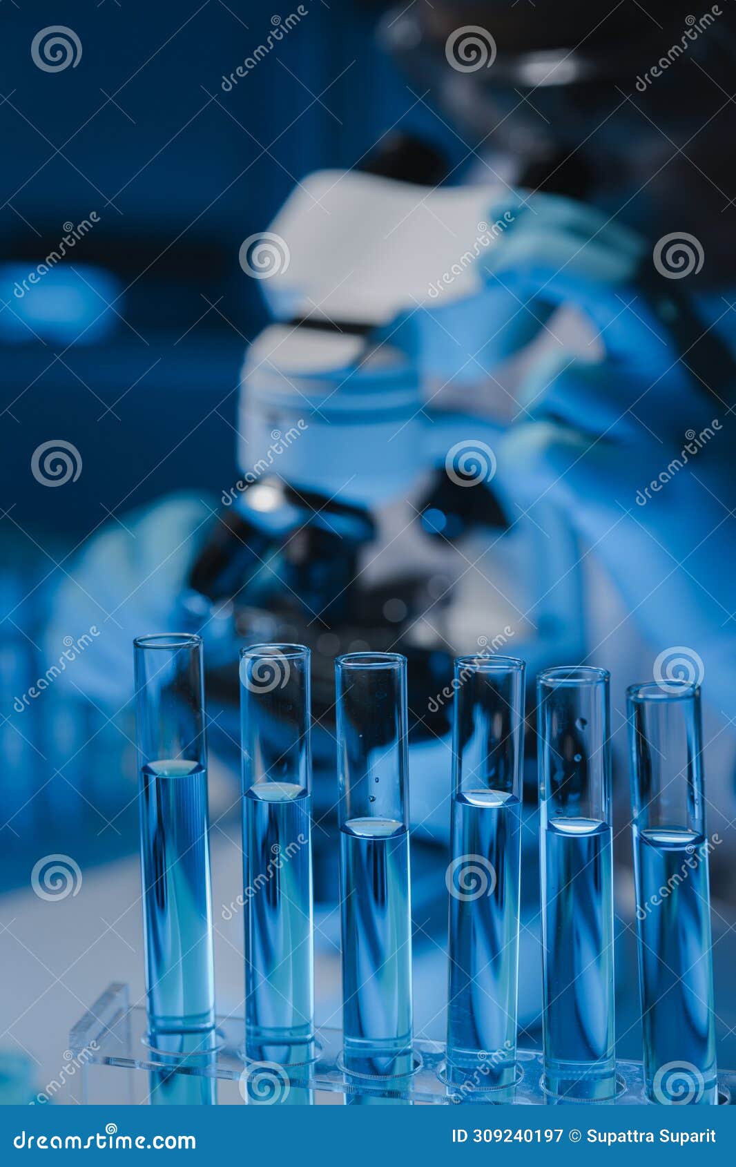 A Scientist is Studying Samples Using a Microscope To Study and Develop ...