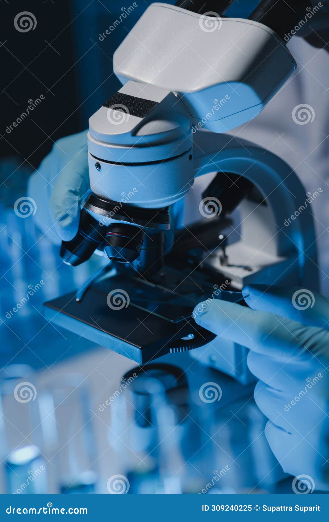 A Scientist is Studying Samples Using a Microscope To Study and Develop ...