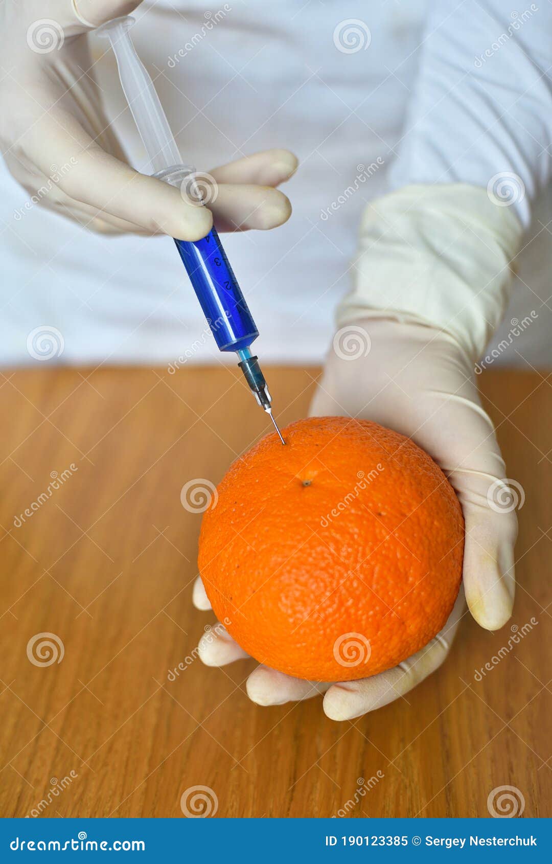 Scientist with Syringe and Orange Stock Image - Image of knowledge ...