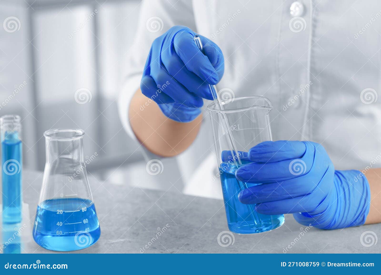 Scientist Taking Sample of Light Blue Liquid in Laboratory, Closeup ...