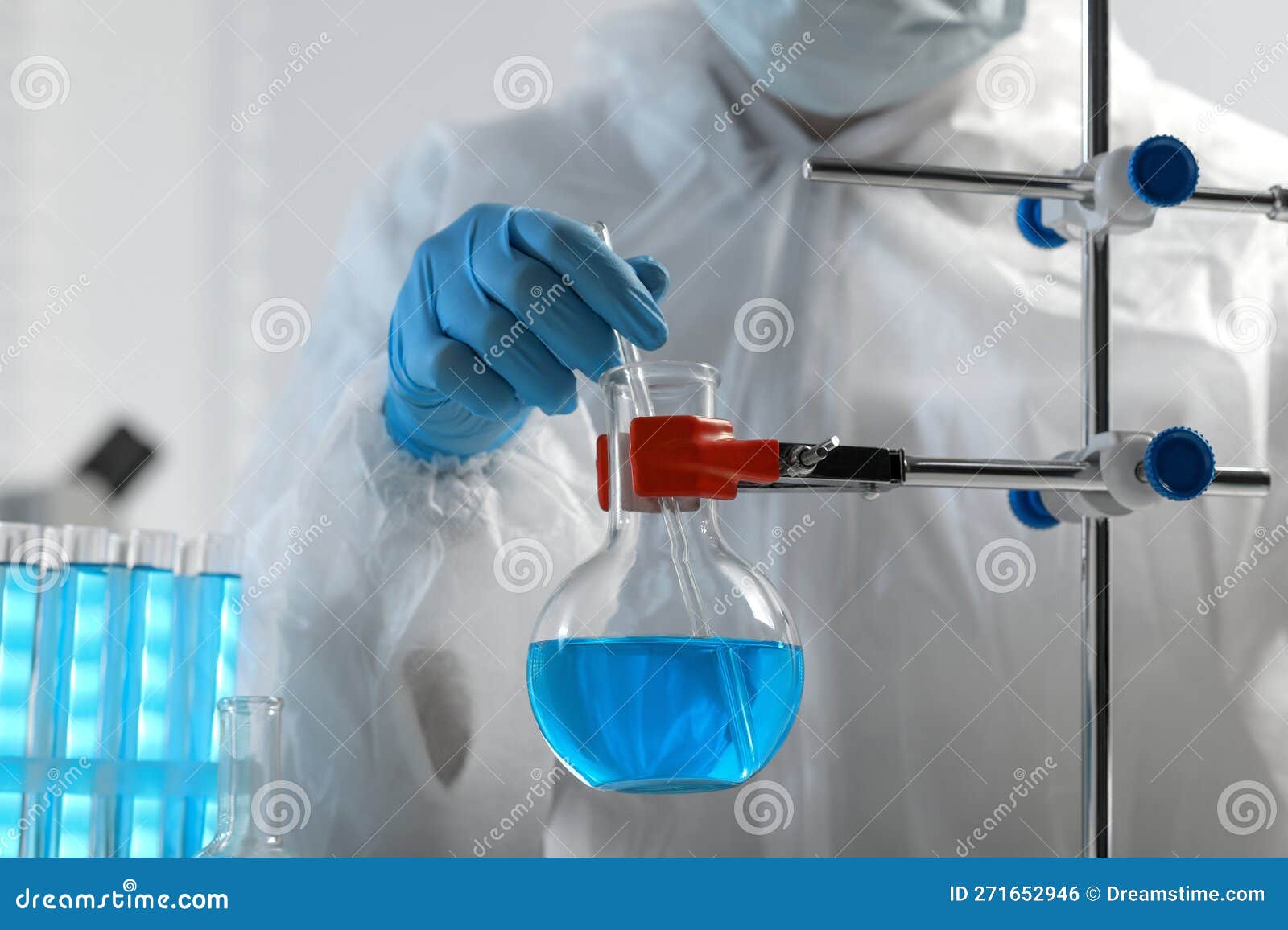 Scientist Taking Sample of Light Blue Liquid in Laboratory, Closeup ...