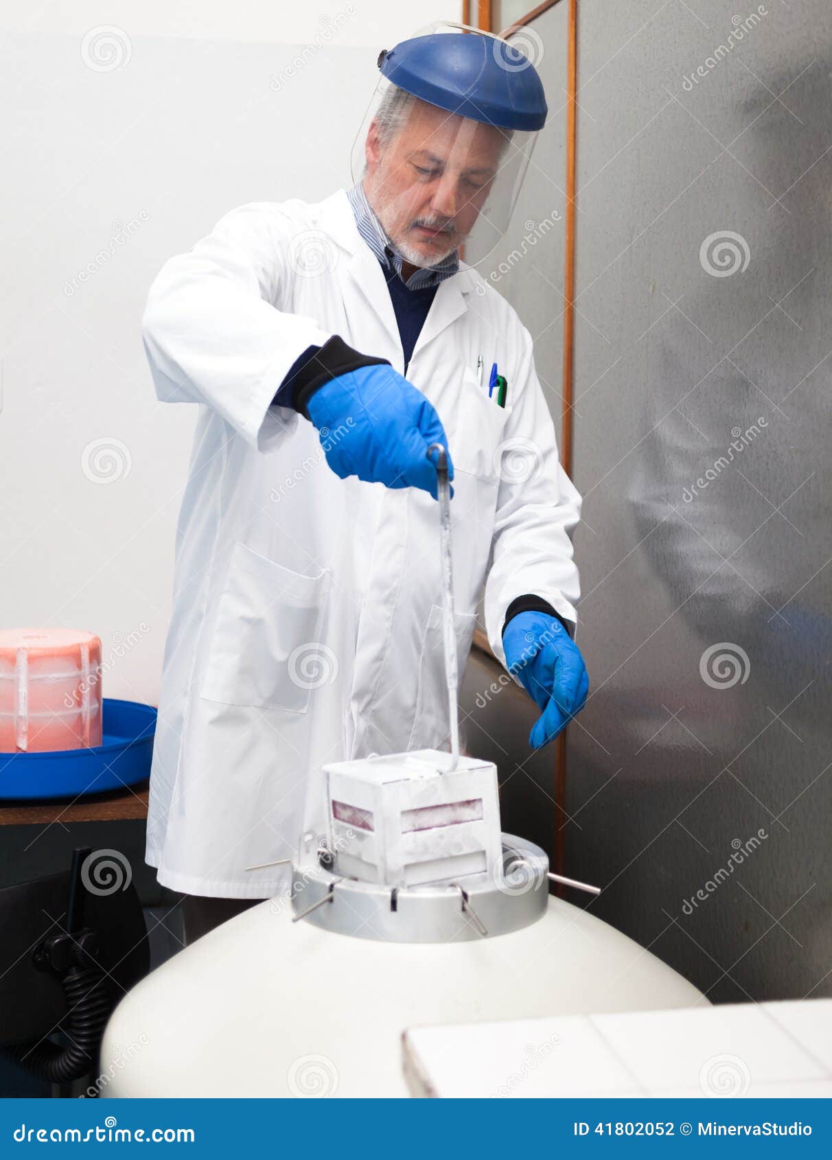 Scientist Taking Samples from a Cryogenic Nitrogen Container Stock ...