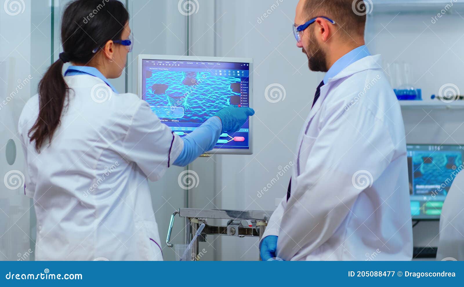 Scientist Team Arguing in Front of Computer Looking at Virus ...