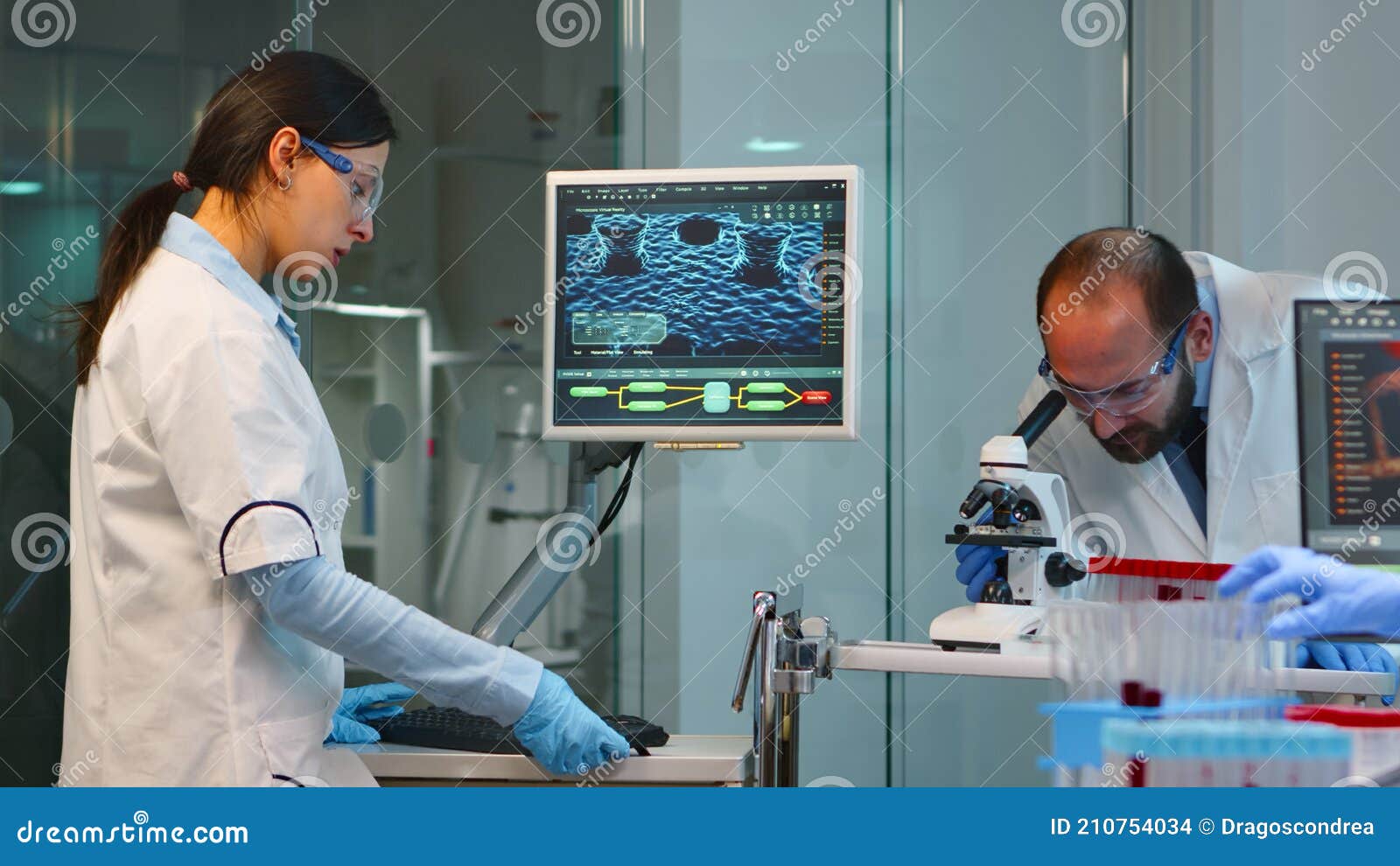 Scientist Team Checking Virus Development Using Microscope Stock Photo ...