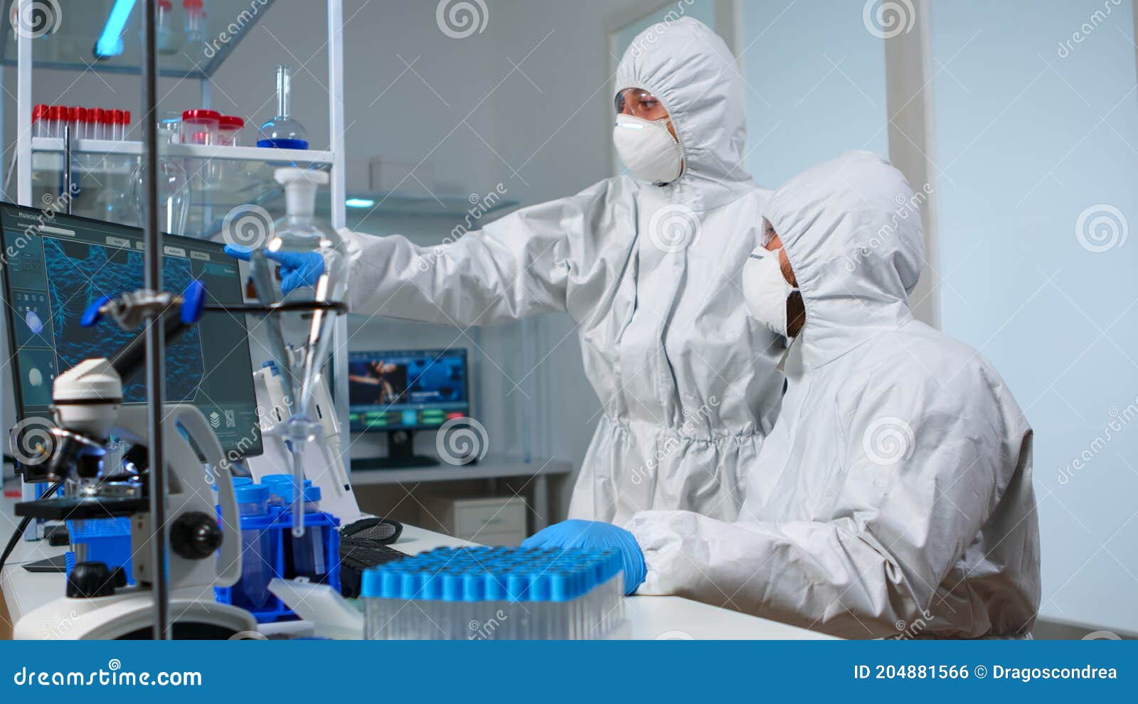 Scientist Team in Prorection Suit Arguing in Front of Pc Stock Photo ...
