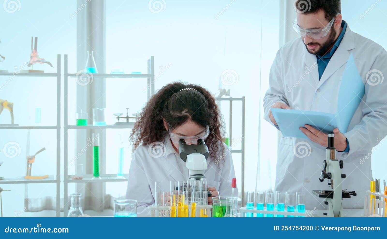 Scientist Team Use Microscope in the Lab. Biotechnology Researcher ...
