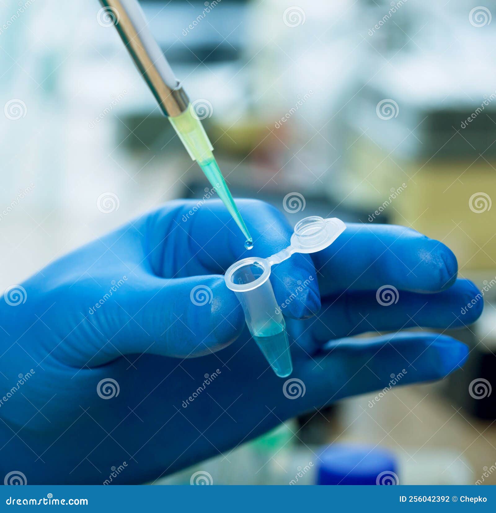 Scientist with Test Tubes and Flasks Conducting an Experiment in a ...