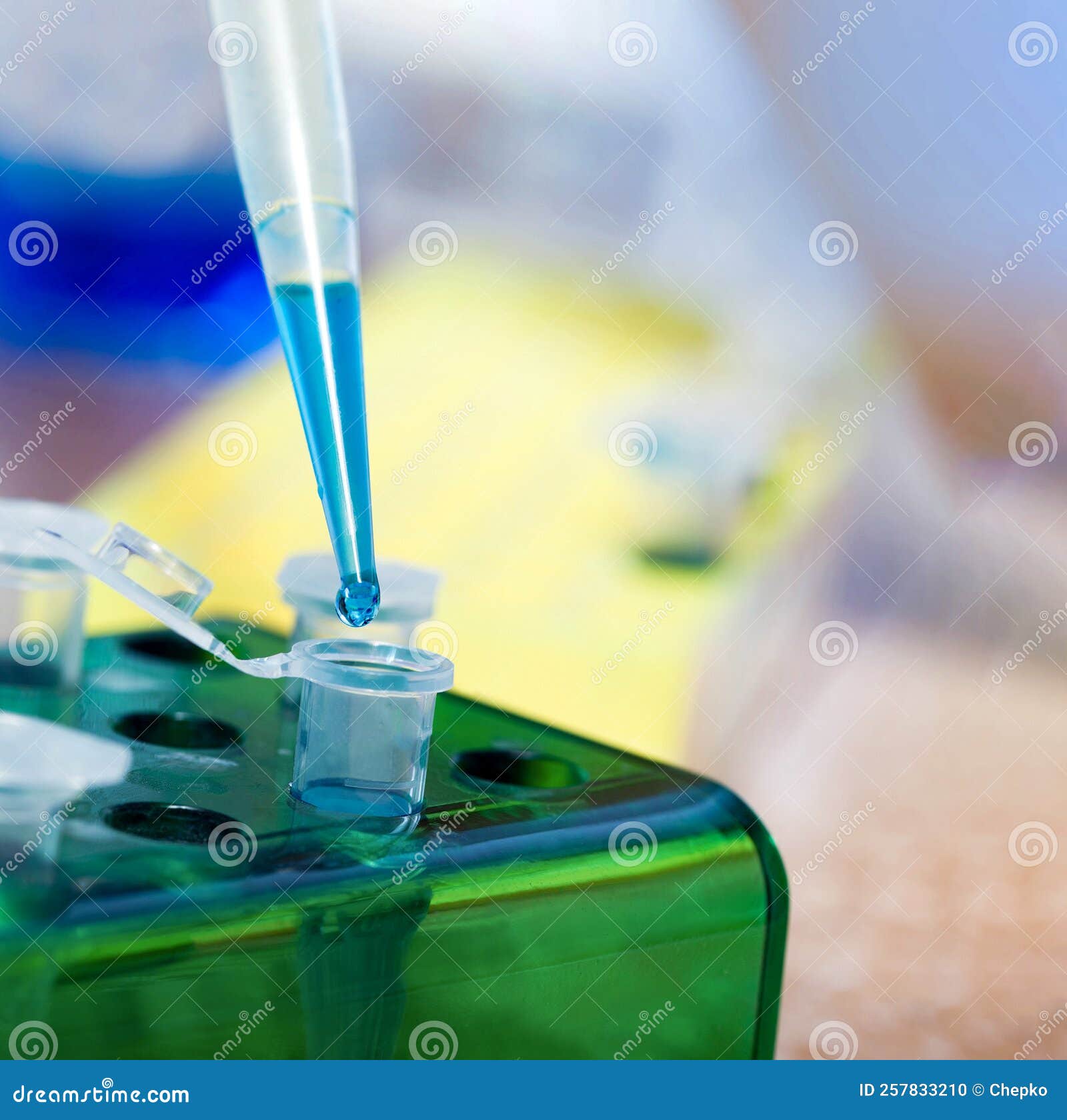 Scientist with Test Tubes and Flasks Conducting an Experiment in a ...