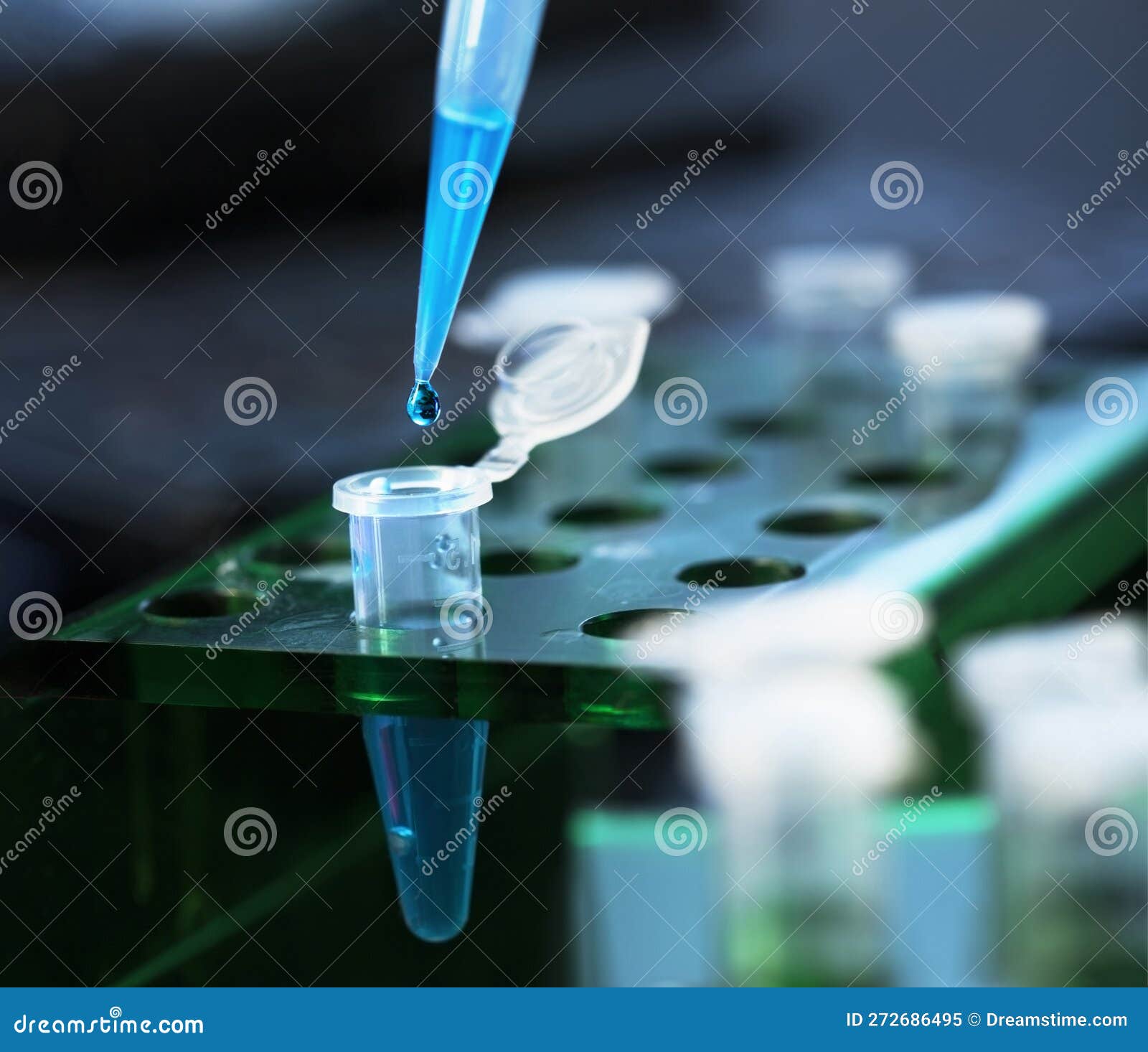 Scientist with Test Tubes and Flasks Conducting an Experiment in a ...