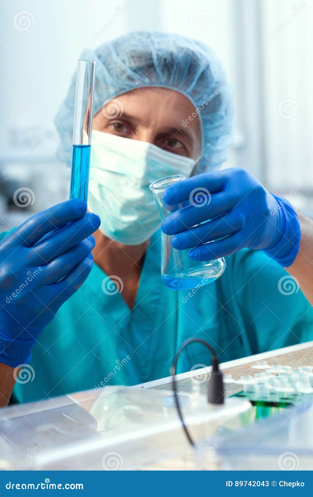 Scientist with test tubes stock image. Image of liquids - 89742043