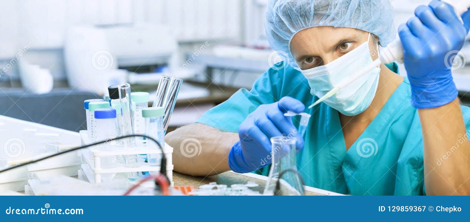 Scientist with test tubes stock image. Image of biotechnology - 129859367