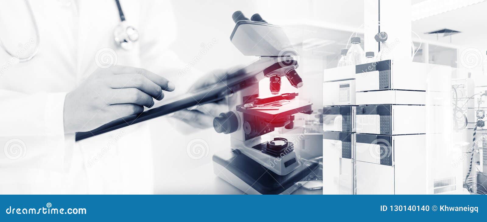 Scientist is Testing and Doing Lab Sample with Microscope in La Stock ...