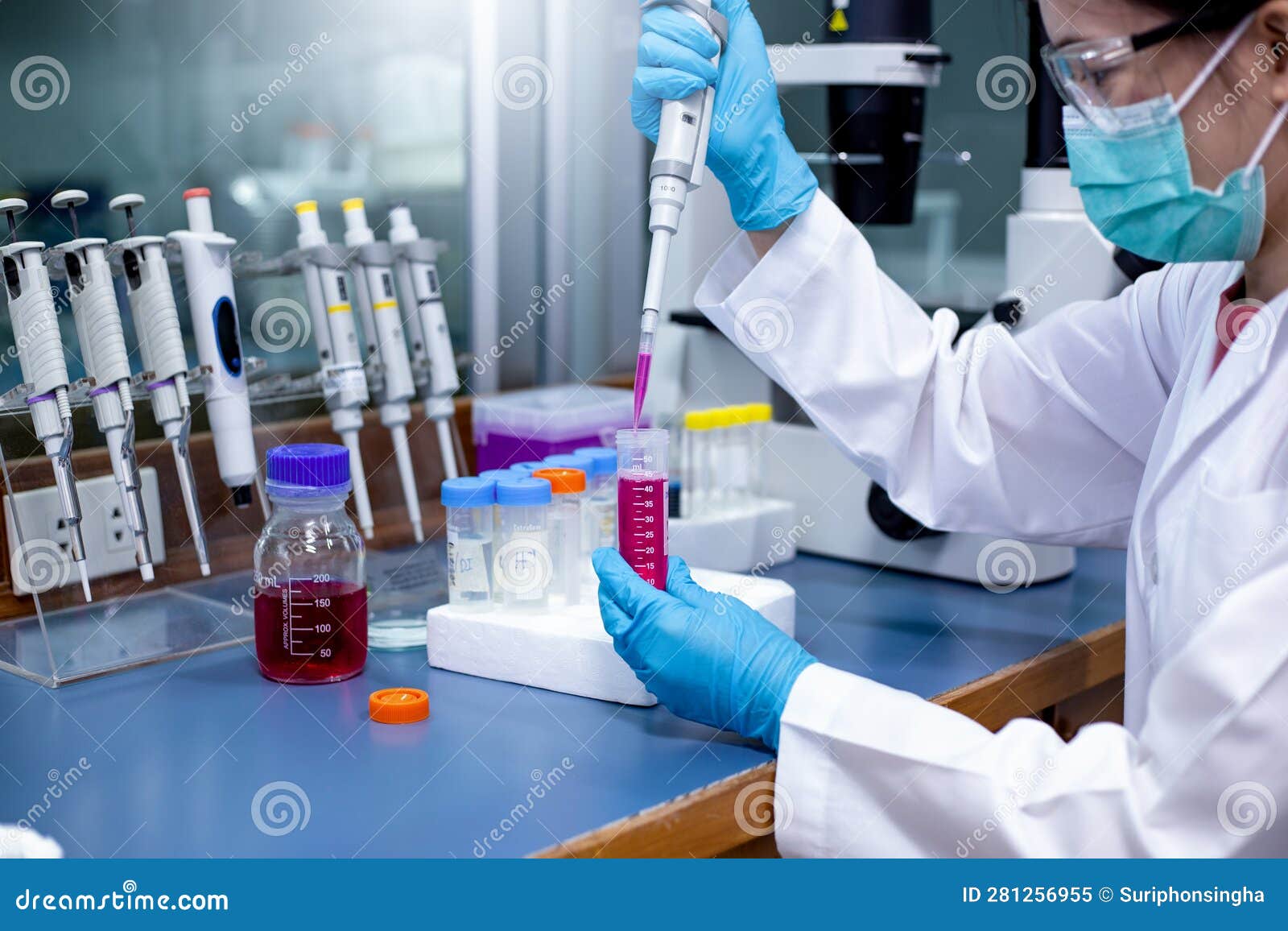 Scientist Use a Micropipette with Sample Preparation in the Laboratory ...