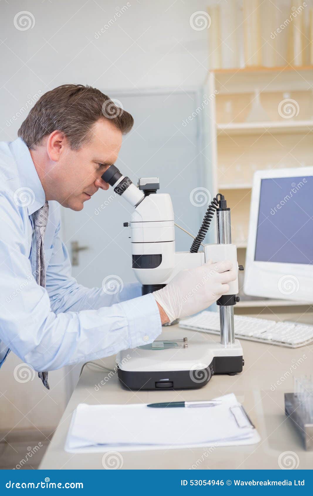 Scientist Using Computer and Microscope Stock Photo - Image of indoors ...