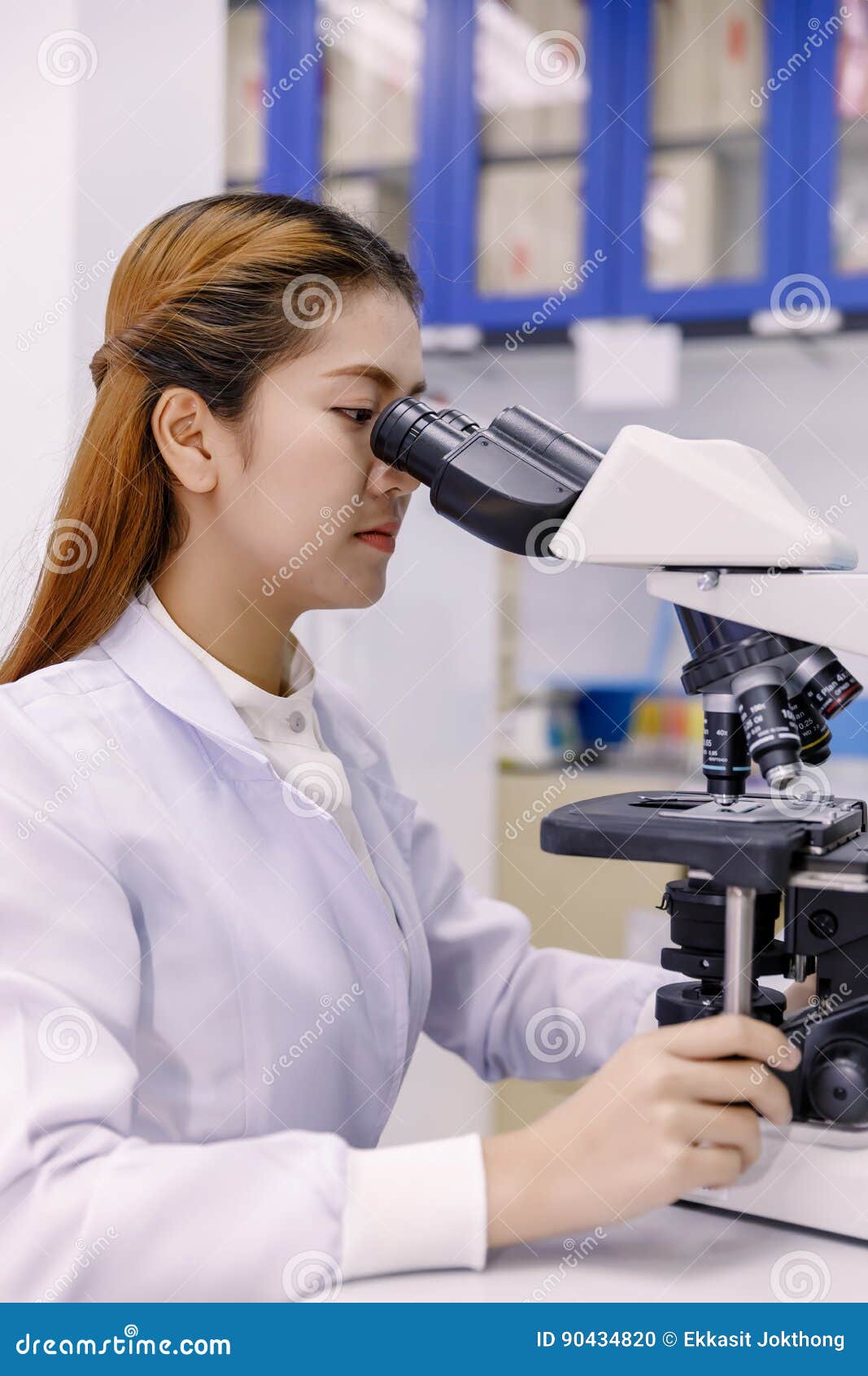 Scientist Using a Microscope in a Laboratory. Stock Photo - Image of ...