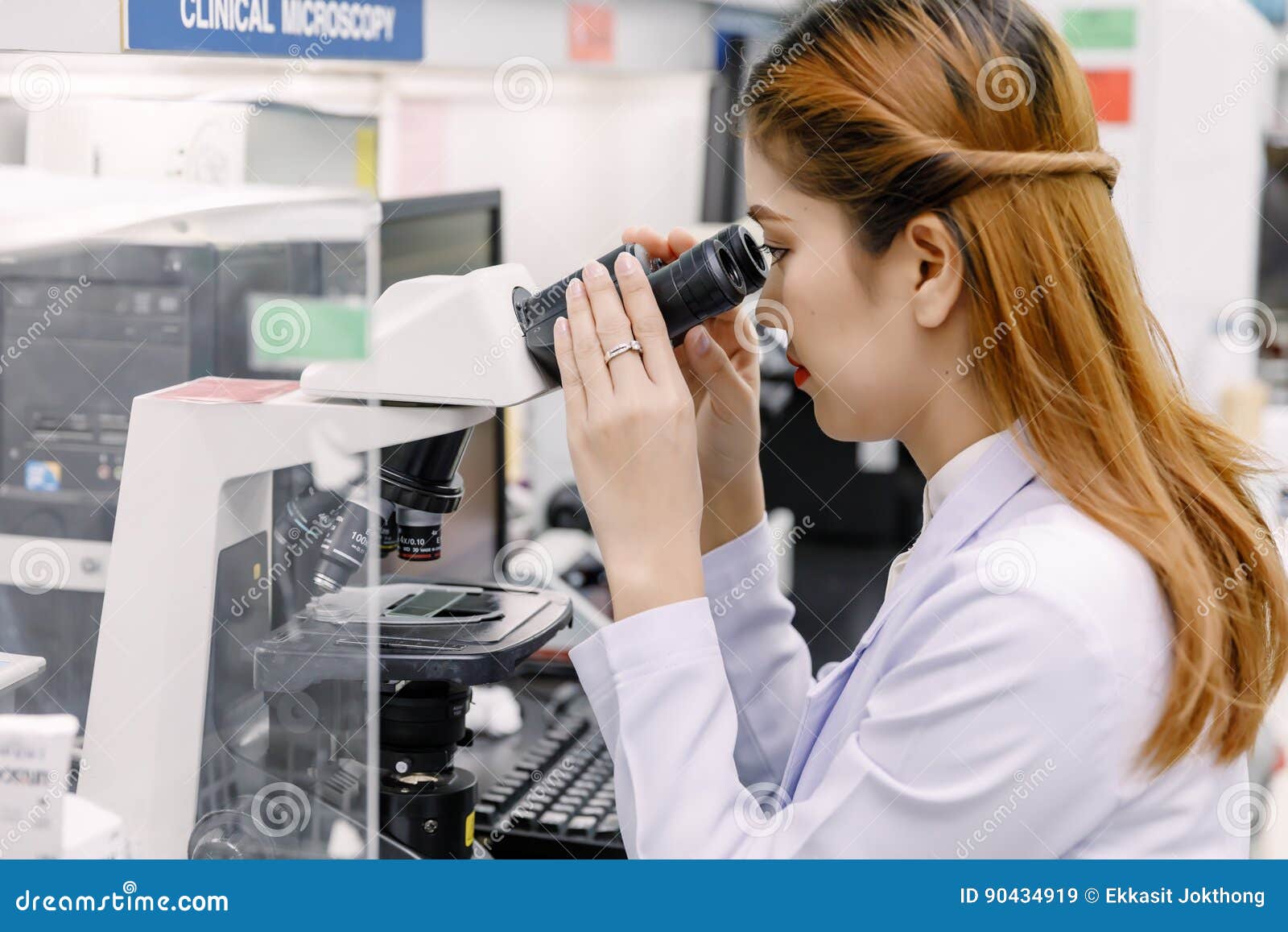 Scientist Using a Microscope in a Laboratory. Stock Image - Image of ...