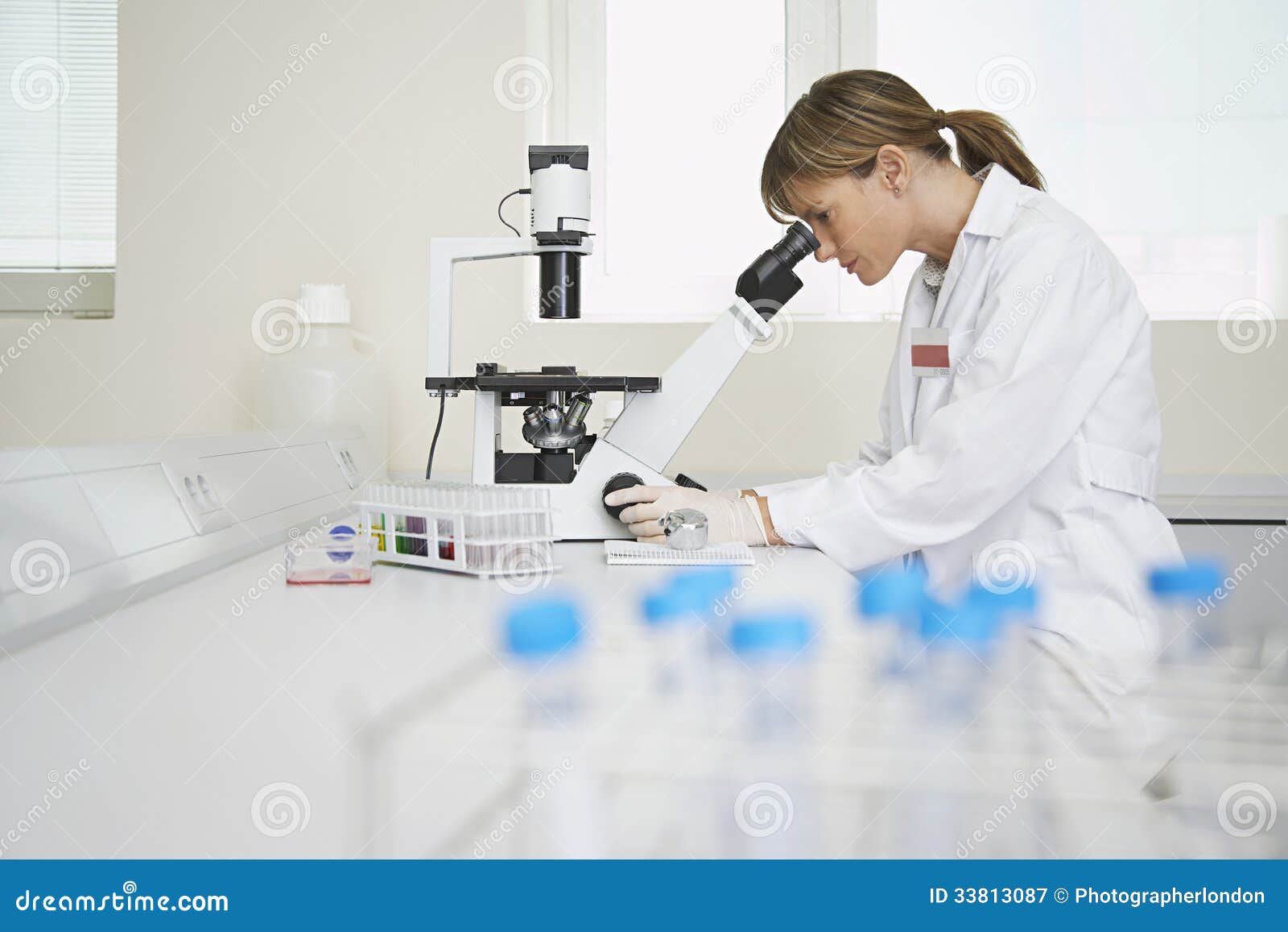 Scientist Using Microscope in Laboratory Stock Image - Image of ...