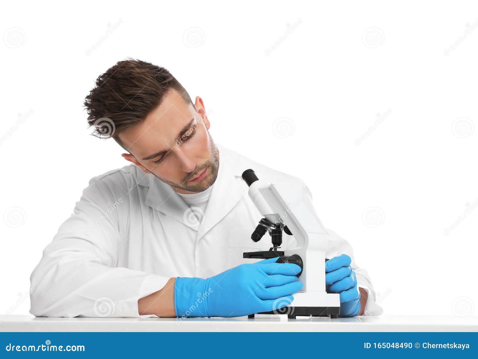Scientist Using Modern Microscope at Table on White. Medical Research ...