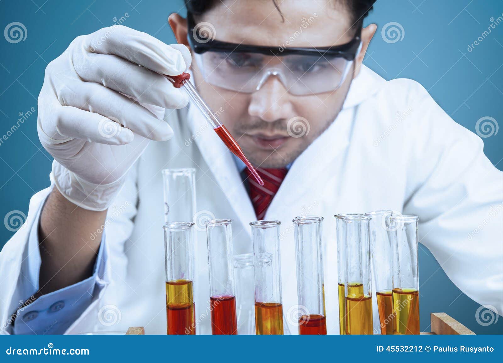Scientist Using Reactants for Experiment Stock Photo - Image of ...