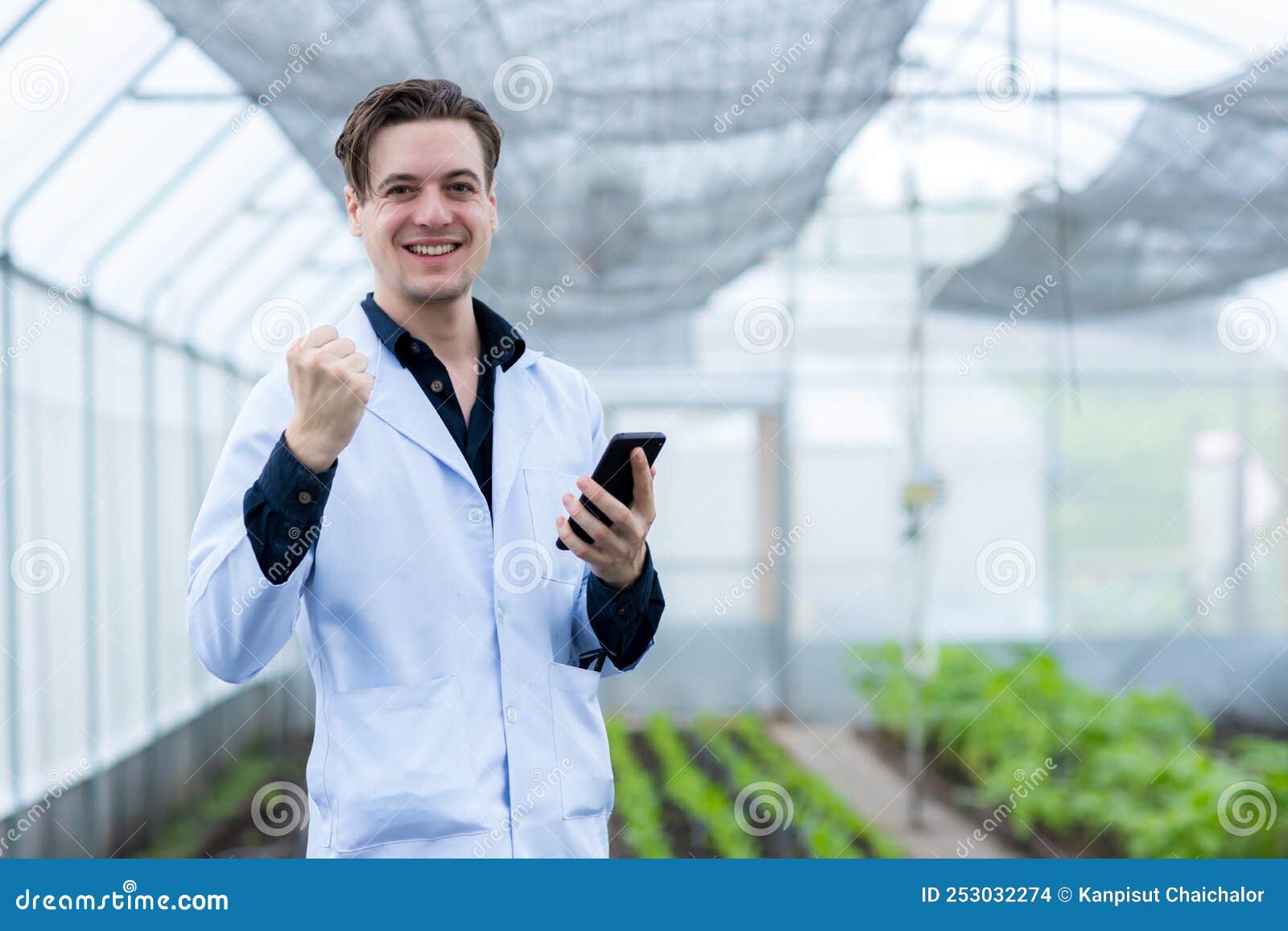 Scientist Using Smart Phone. Scientist Work at Vegetable Garden Lab ...