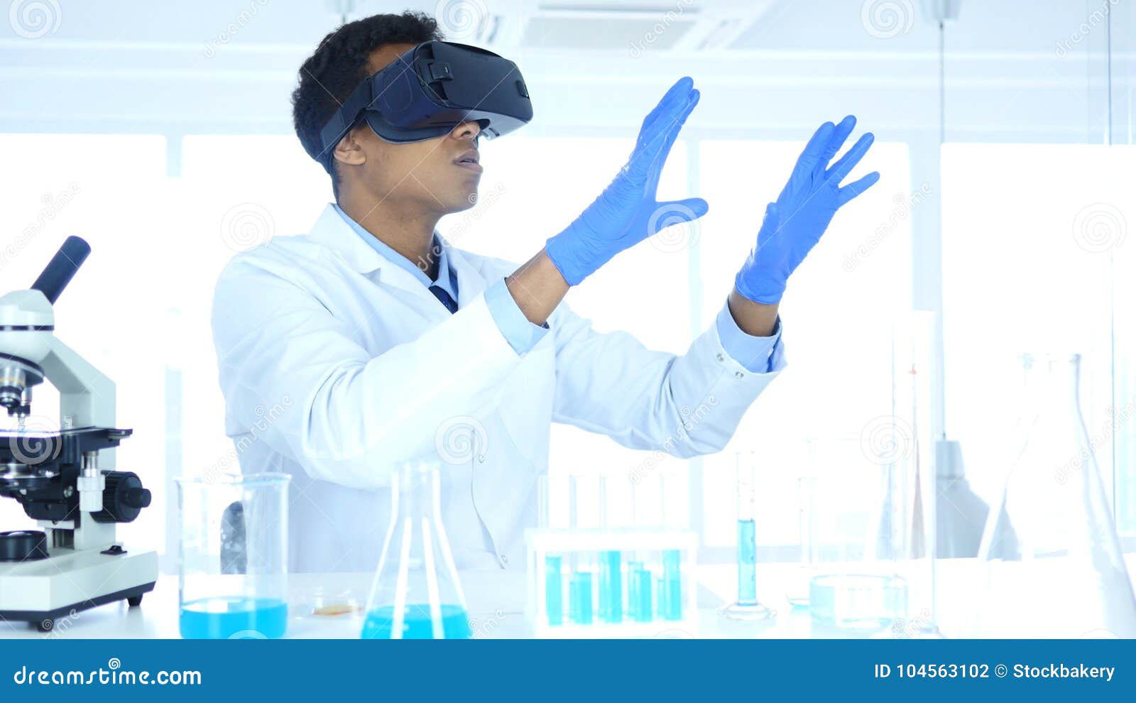 Scientist Using Virtual Reality Glasses for Research and Imagination in ...
