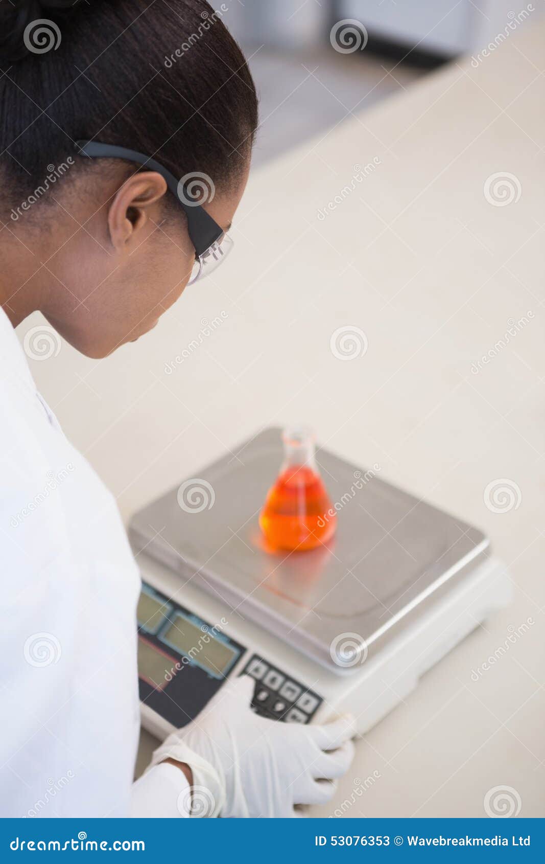 Scientist Weighing Beaker with Orange Fluid Inside Stock Image - Image ...