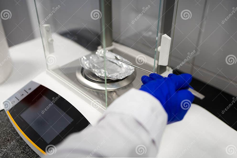 Scientist Weighing a Sample on a Scale Stock Image - Image of ...