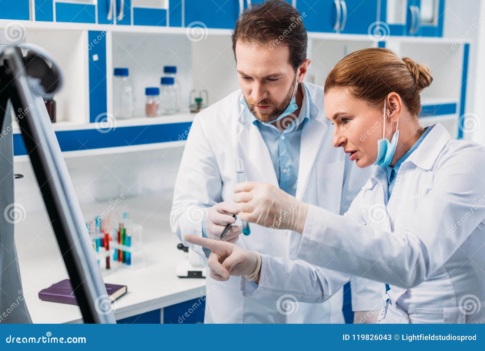 Scientist in White Coats Near Board for Notes Having Discussion during ...