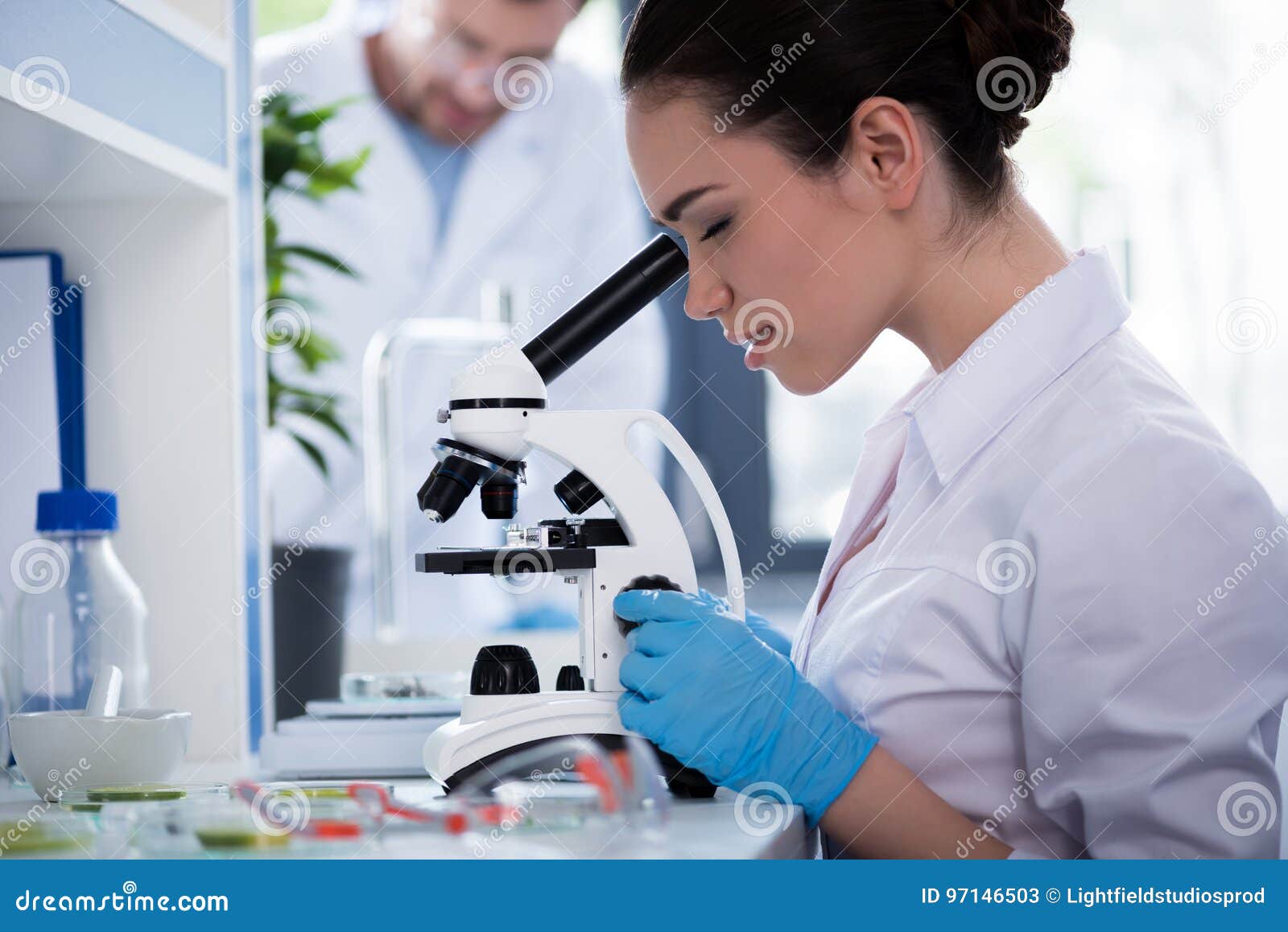 Scientist during Work with Microscope at Modern Biological Laboratory ...