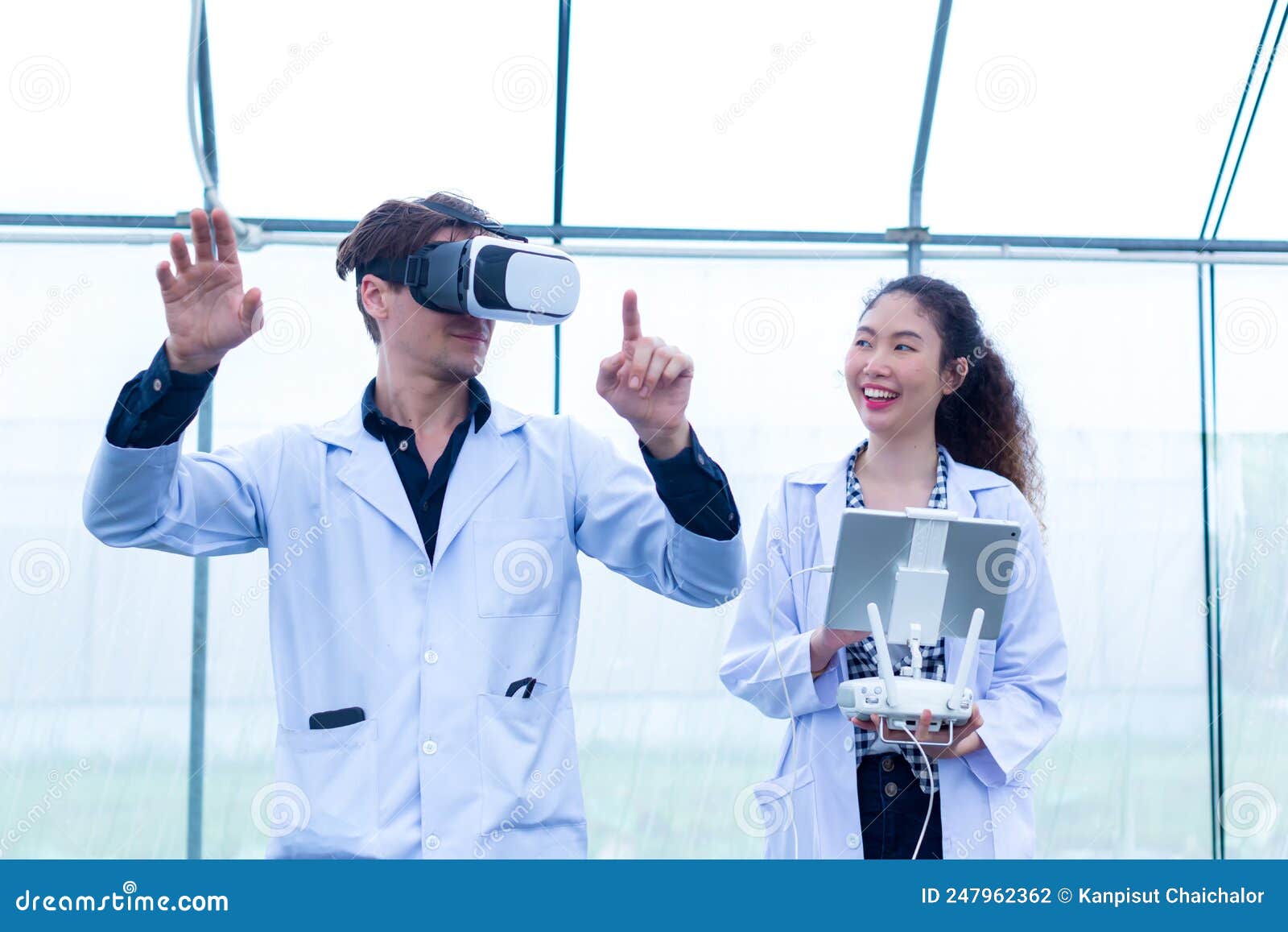 Scientist or Worker Use Remote Controller Piloting Drone at Garden ...