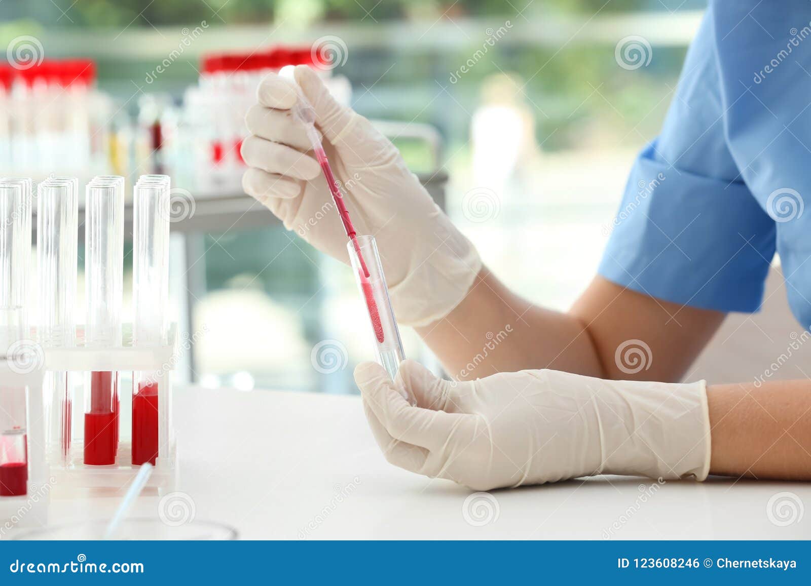 Scientist Working with Blood Sample at Table Stock Photo - Image of ...