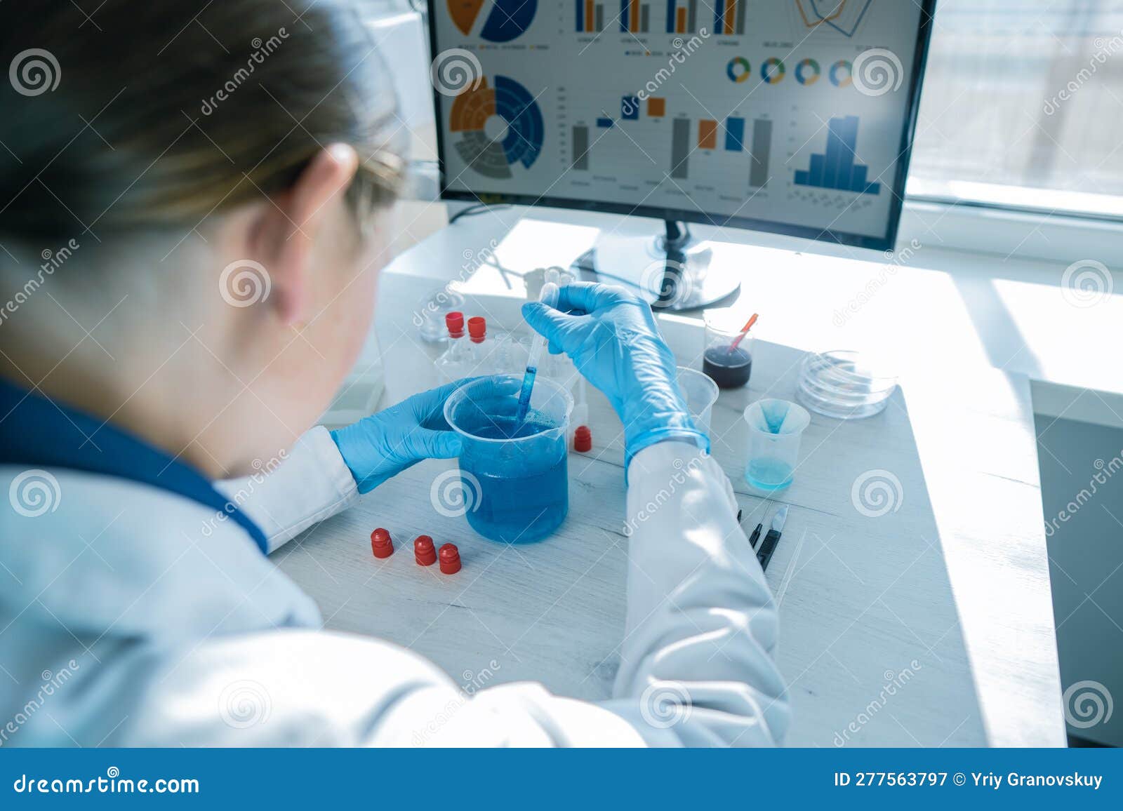 A Scientist Working with Genetic Material in a Biotechnology Laboratory ...