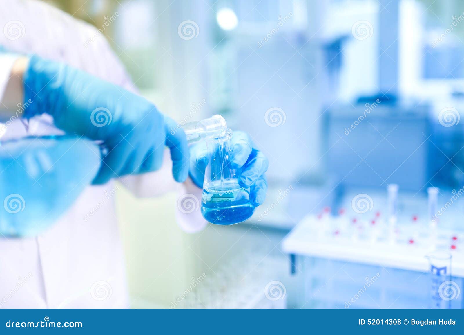 Scientist Working in Laboratory, Pouring Liquid Substances and Testing ...