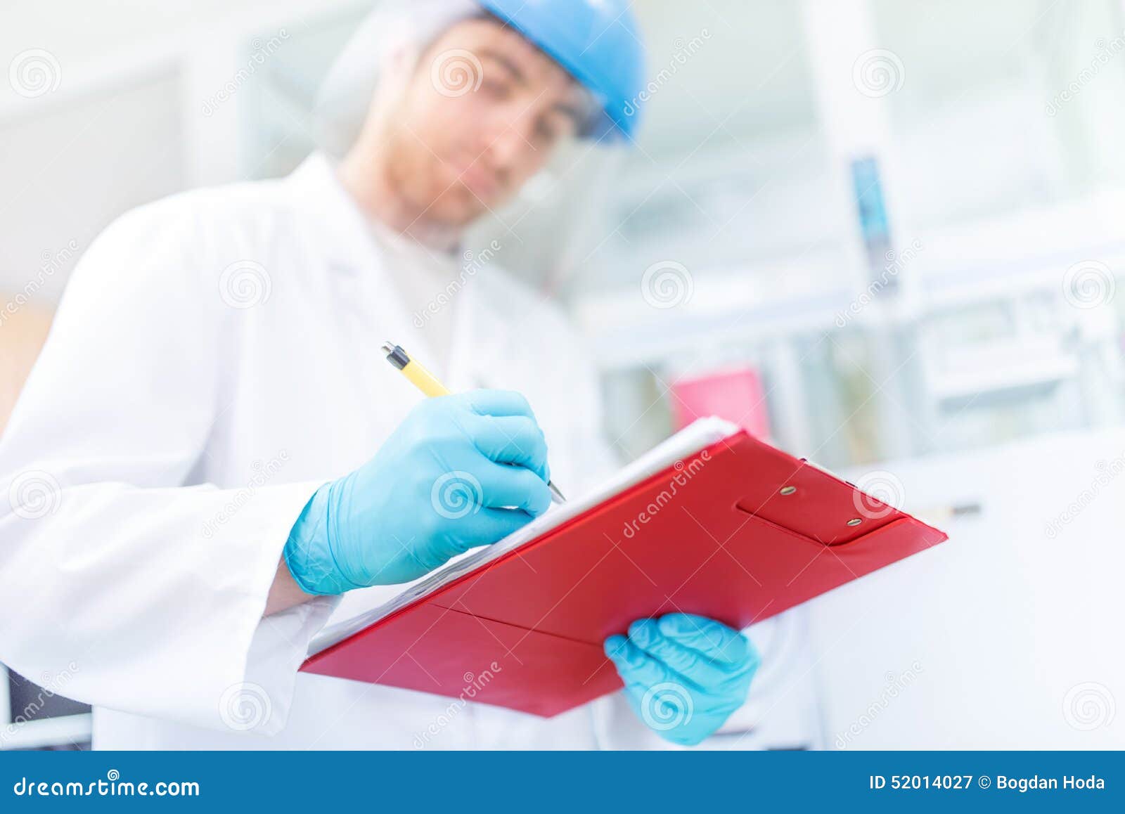Scientist Working in Laboratory, Writing and Taking Notes on Clipboard ...