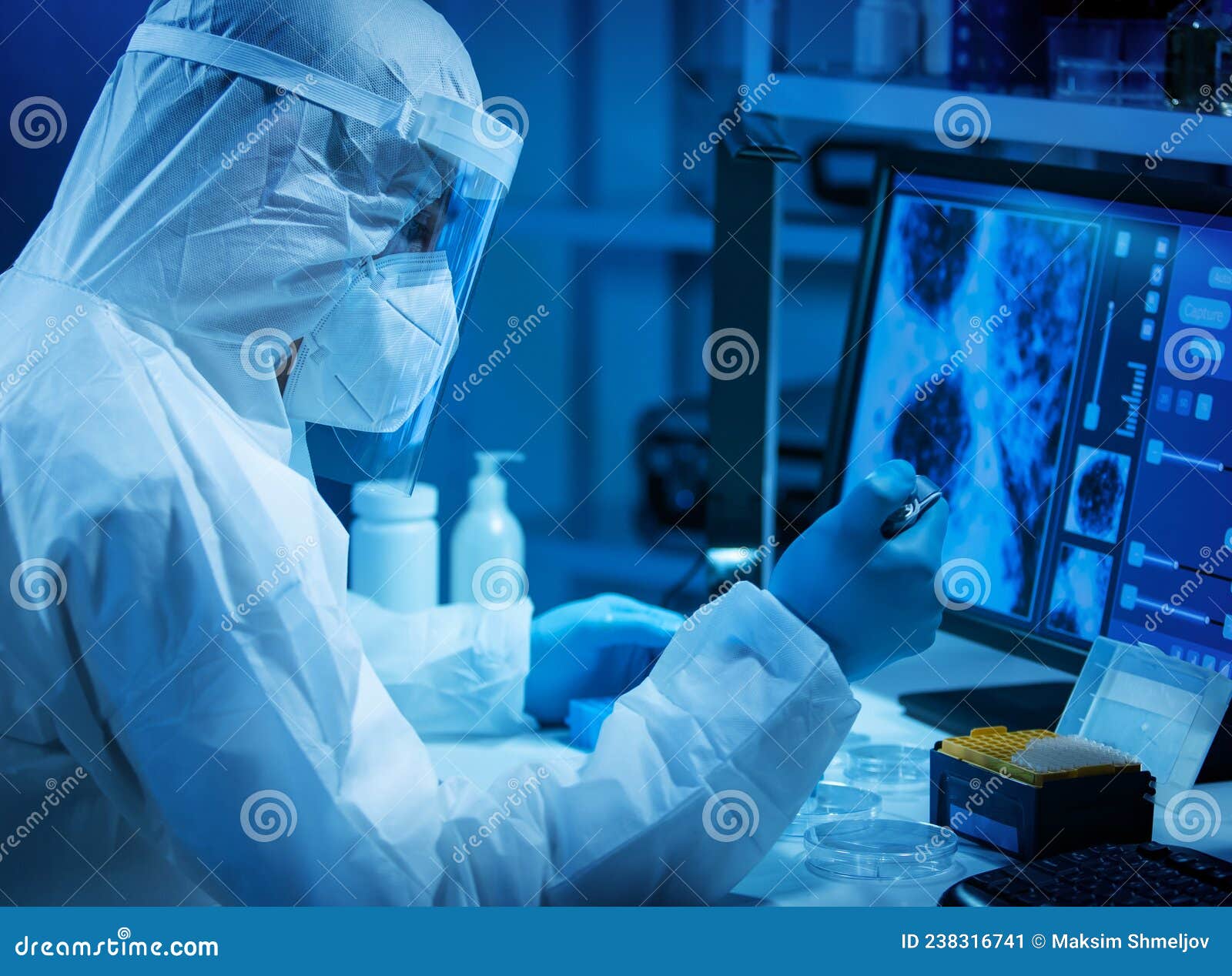 Scientist Works in a Modern Scientific Lab Using Laboratory Equipment ...