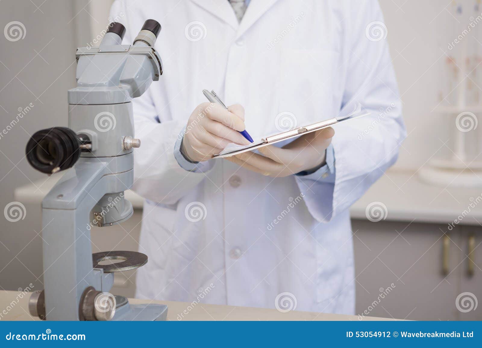 Scientist Writing on Clipboard Stock Photo - Image of writing, research ...