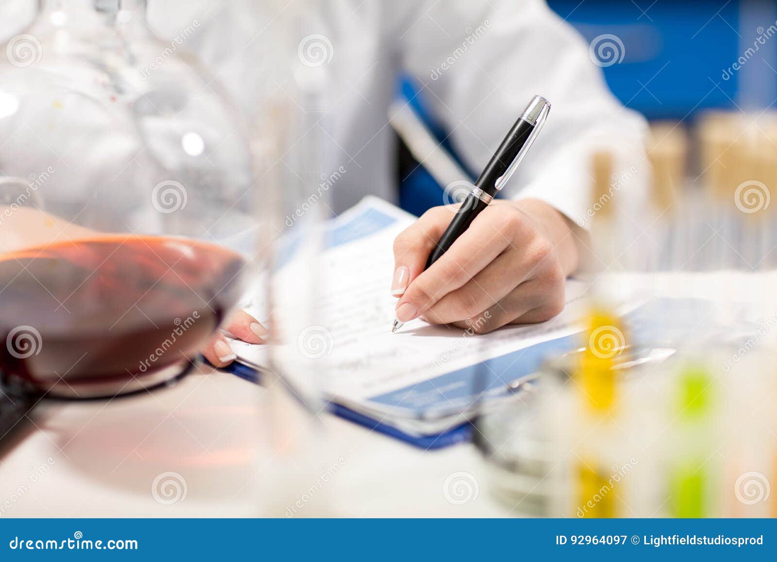 Scientist Writing in Notepad in Laboratory Stock Image - Image of ...