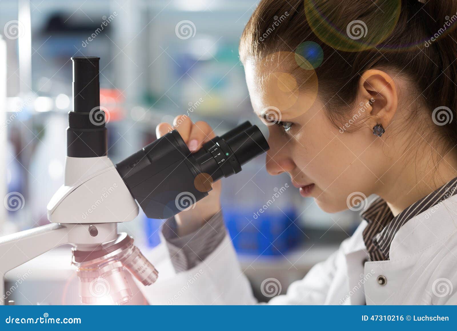Scientist Young Woman Using a Microscope in a Science Stock Photo ...