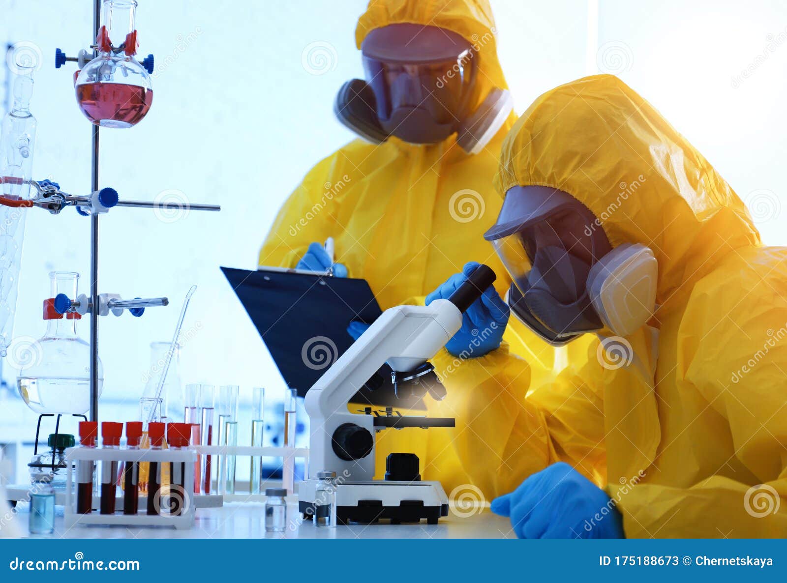 Scientists in Chemical Protective Suits Working. Virus Research Stock ...